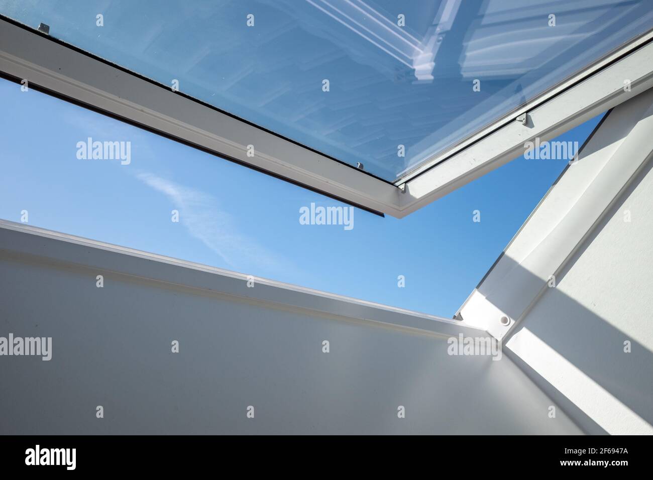 Interior view and close-up detail at open white Tilt Window Skylights ...
