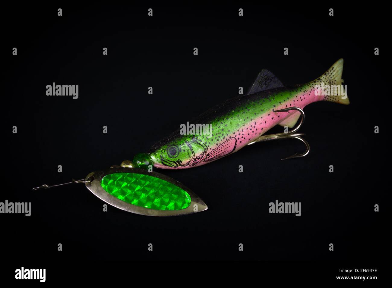 Old soft plastic fishing lure and spinner with black background Stock ...