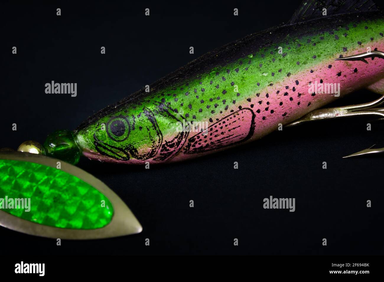 Old soft plastic fishing lure and spinner with black background Stock ...