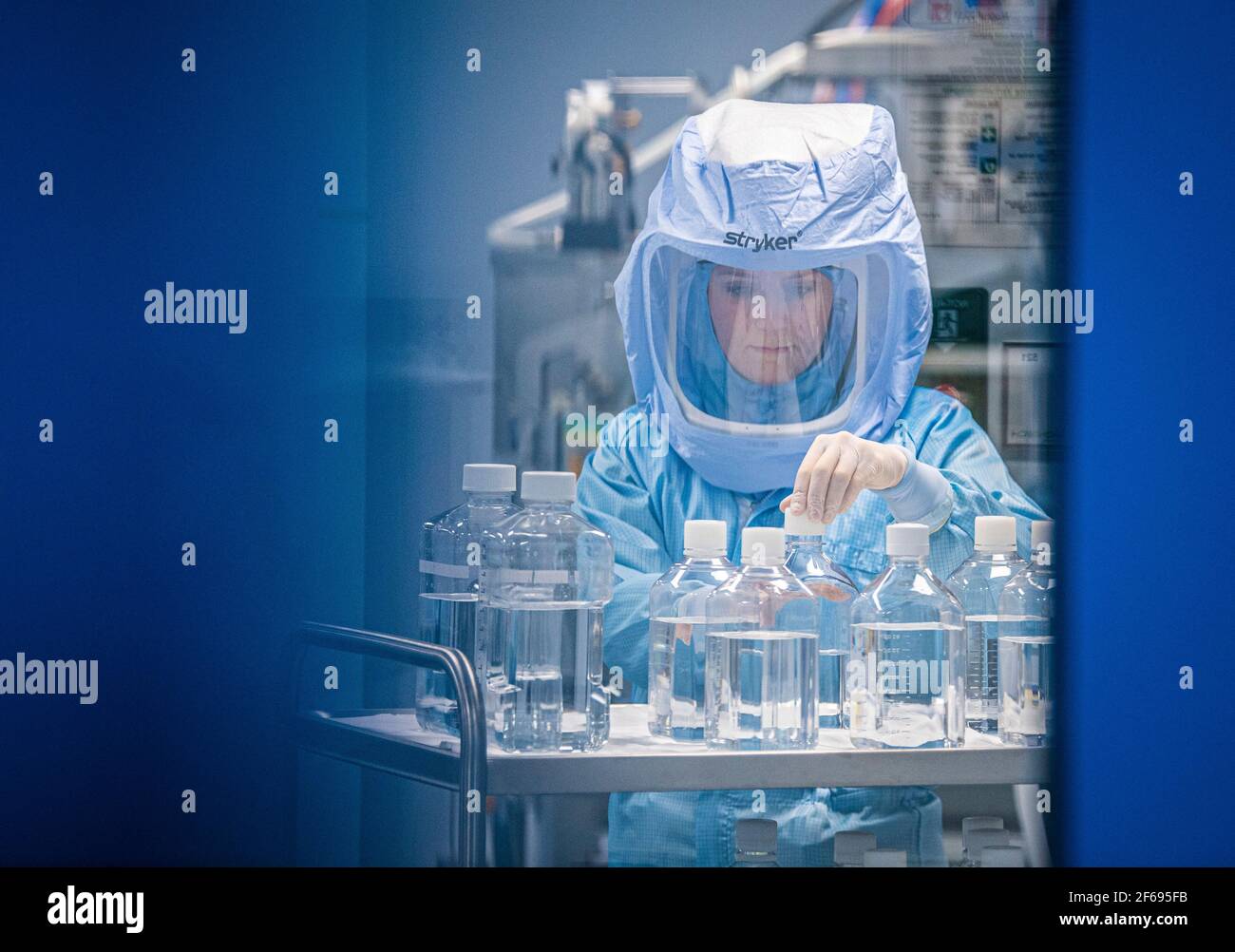 27 March 2021, Hessen, Marburg: Wearing full-body protective suits ...