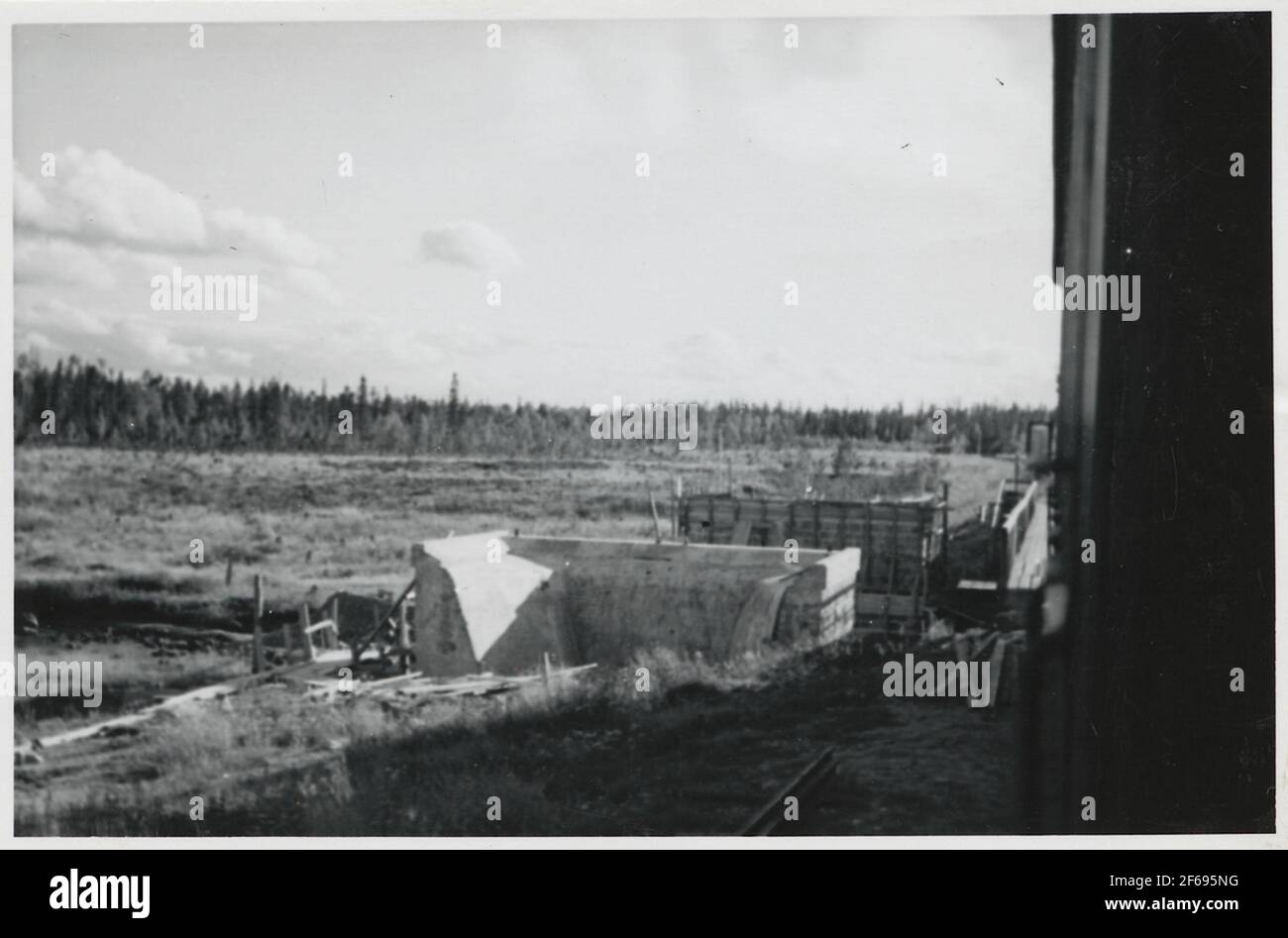 From the train window you see forest and sump land on the defense ...