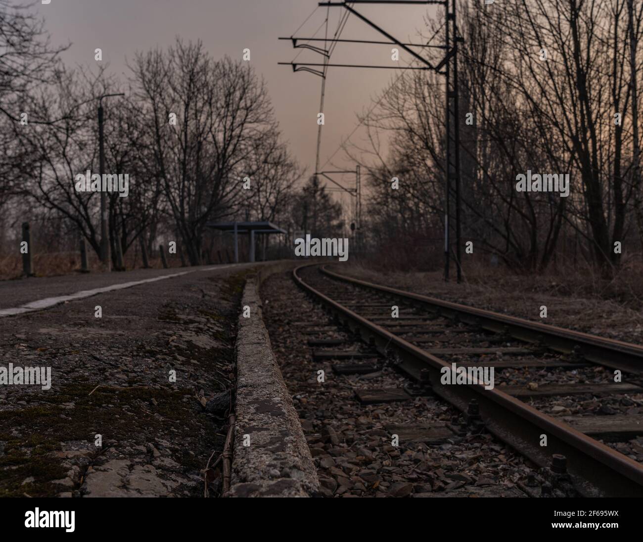 Old abandoned train station with rusty railroad tracks Stock Photo - Alamy