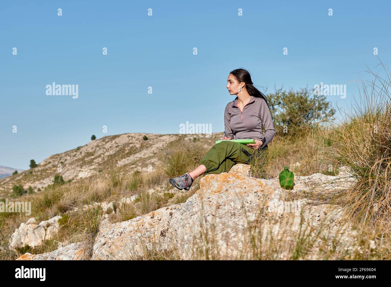 Woman explorer and geographer analyzes the environment Stock Photo - Alamy