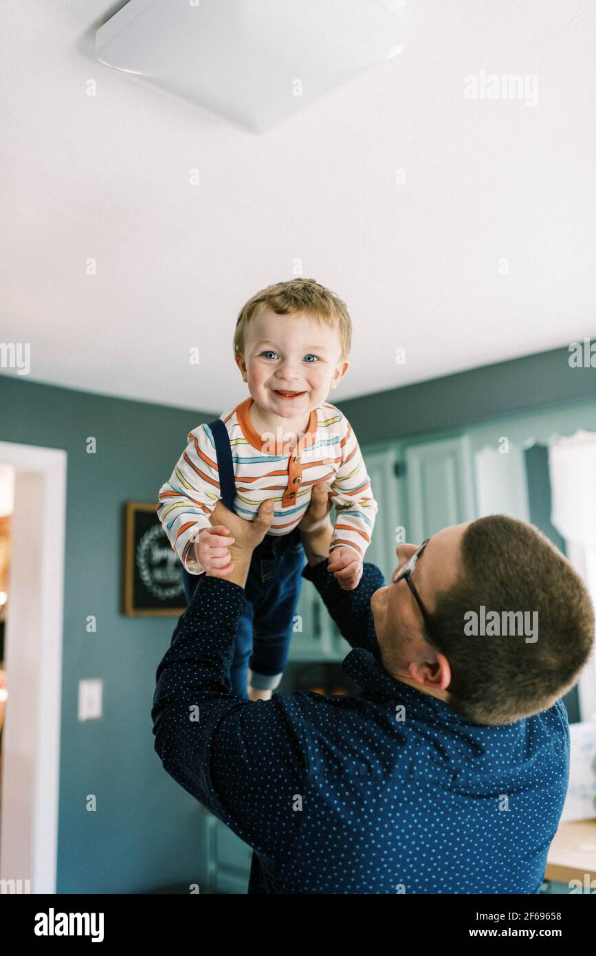 Father lifting baby boy hi-res stock photography and images - Alamy