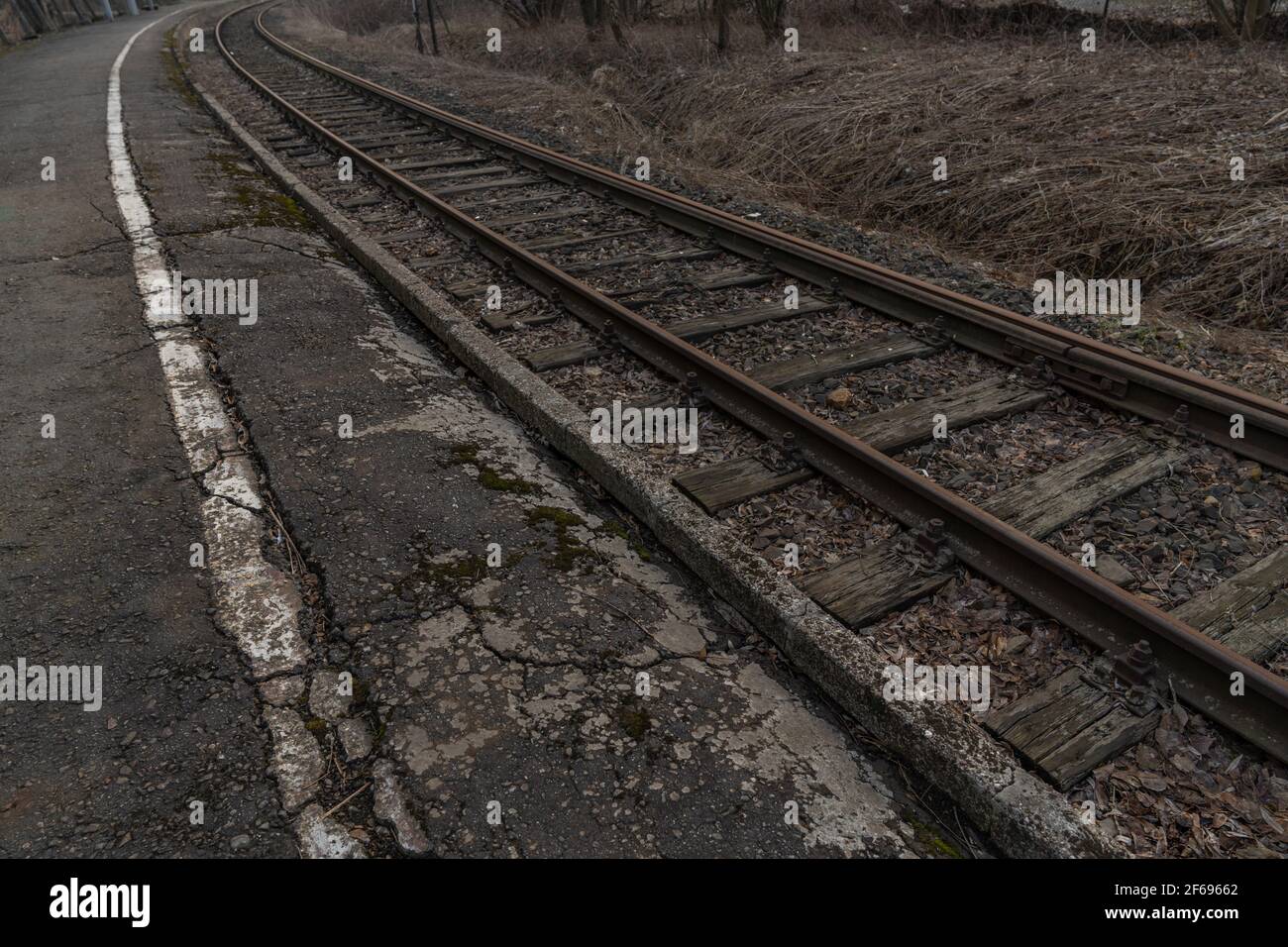 Old abandoned train station with rusty railroad tracks Stock Photo - Alamy
