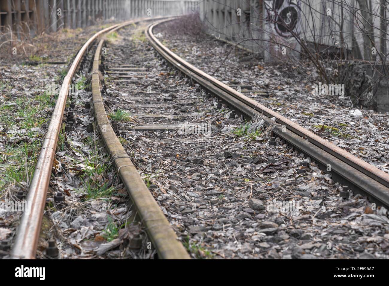 Old abandoned train station with rusty railroad tracks Stock Photo - Alamy