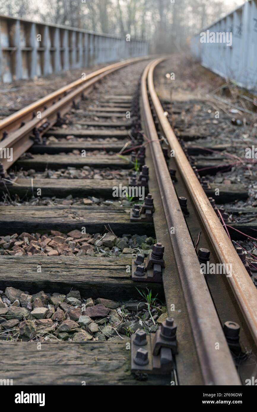 Old abandoned train station with rusty railroad tracks Stock Photo - Alamy