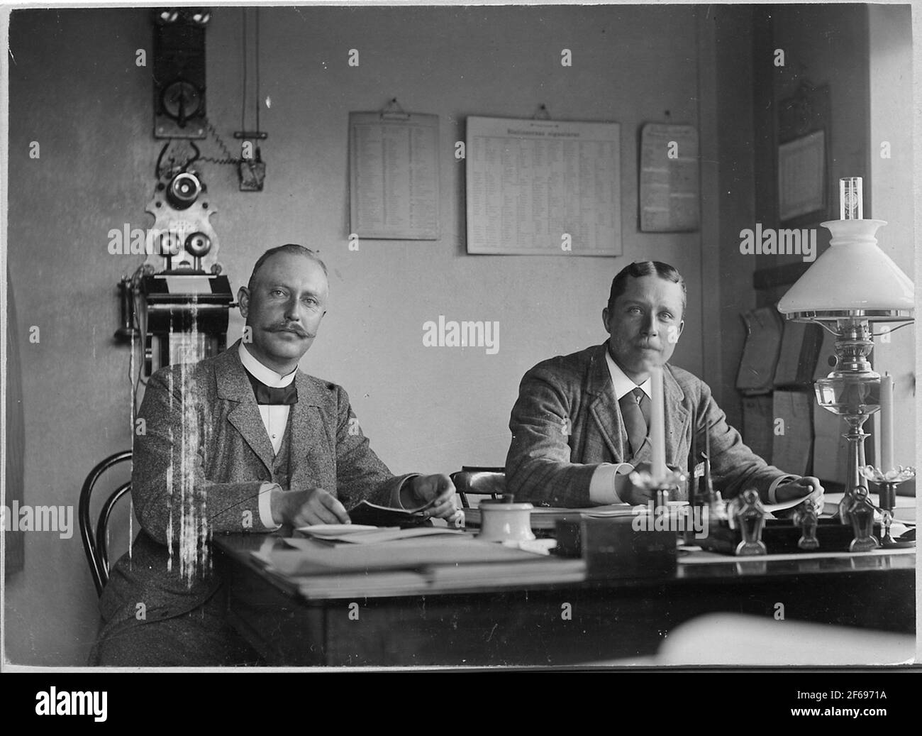 Two men in work in the office Stock Photo - Alamy