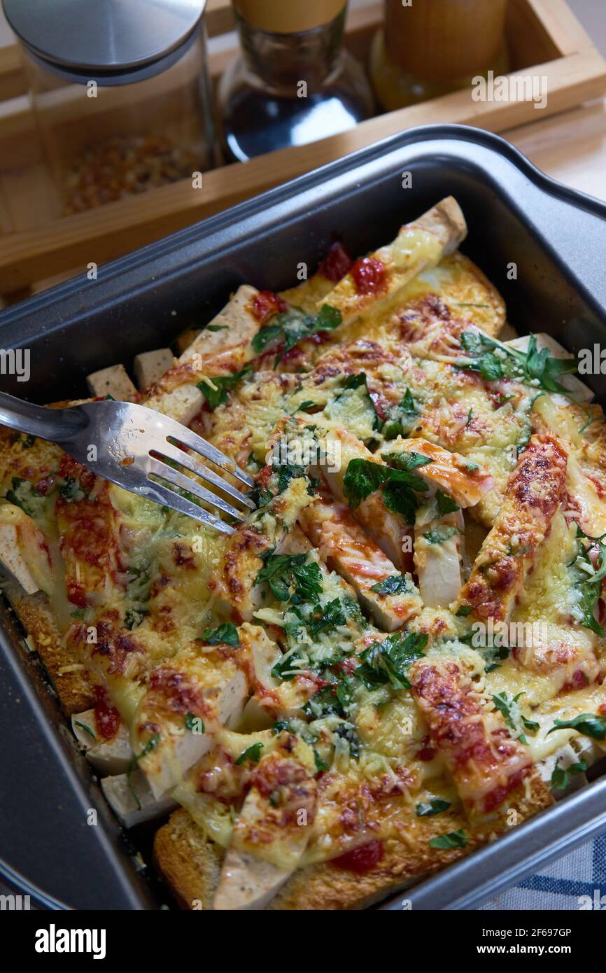 The baked food in the baking tray Stock Photo - Alamy