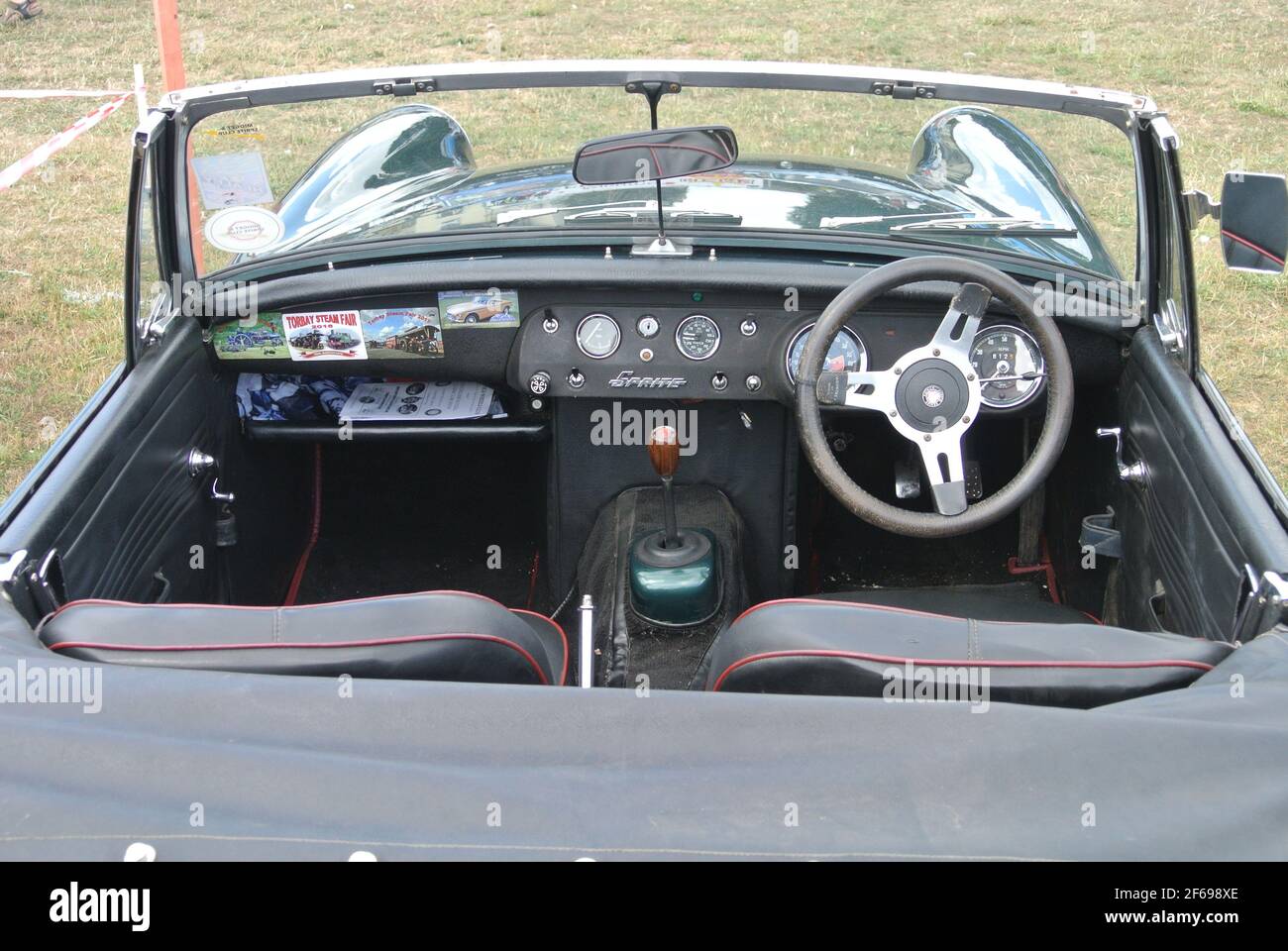The front interior of a 1970 Austin Healey Sprite parked up on display ...