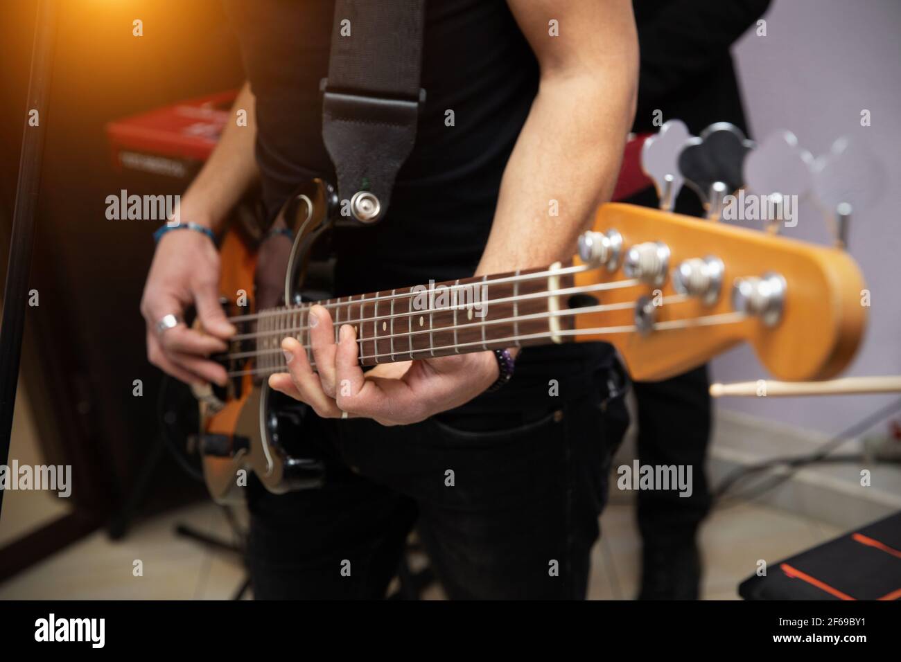 Hands man playing electric bass hi-res stock photography and images - Alamy