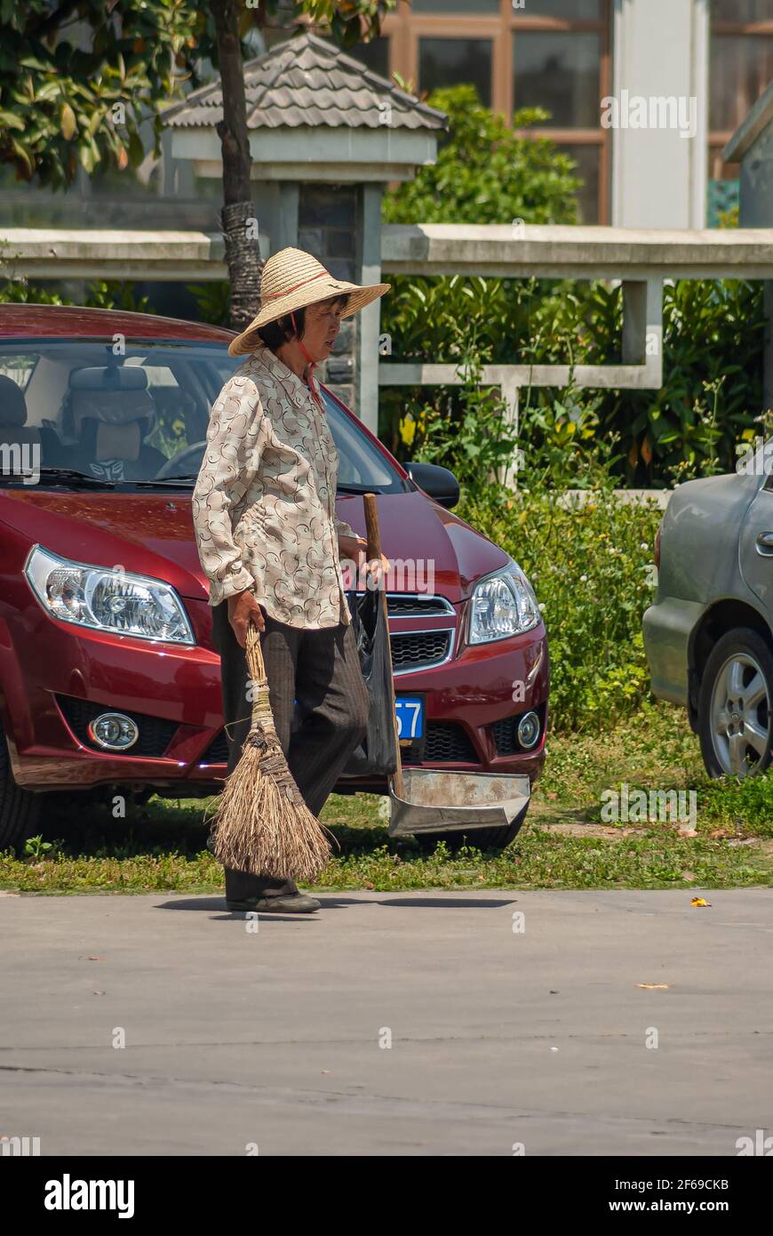Female street sweeper hi-res stock photography and images - Alamy