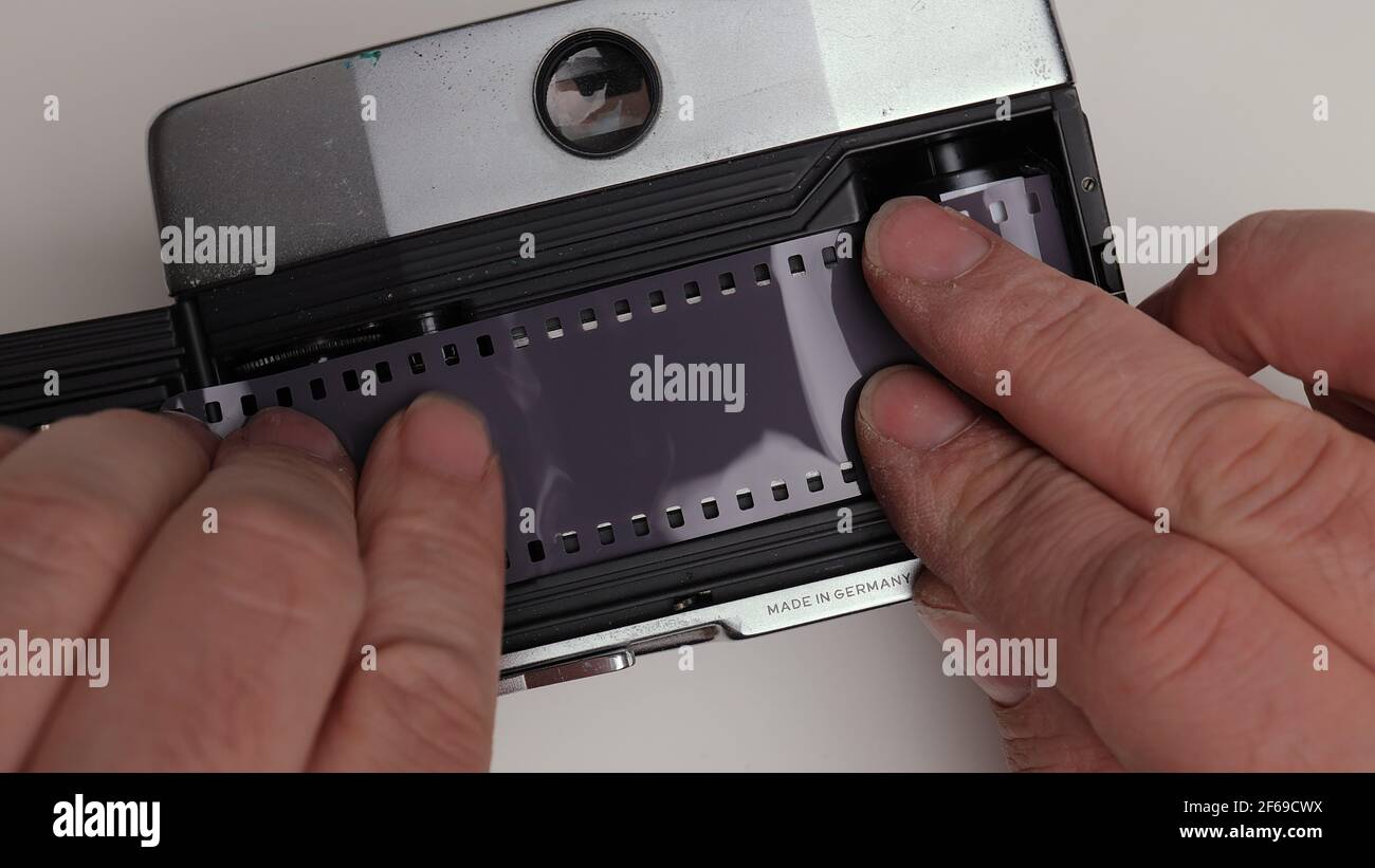 Loading a negative film into a camera Stock Photo - Alamy