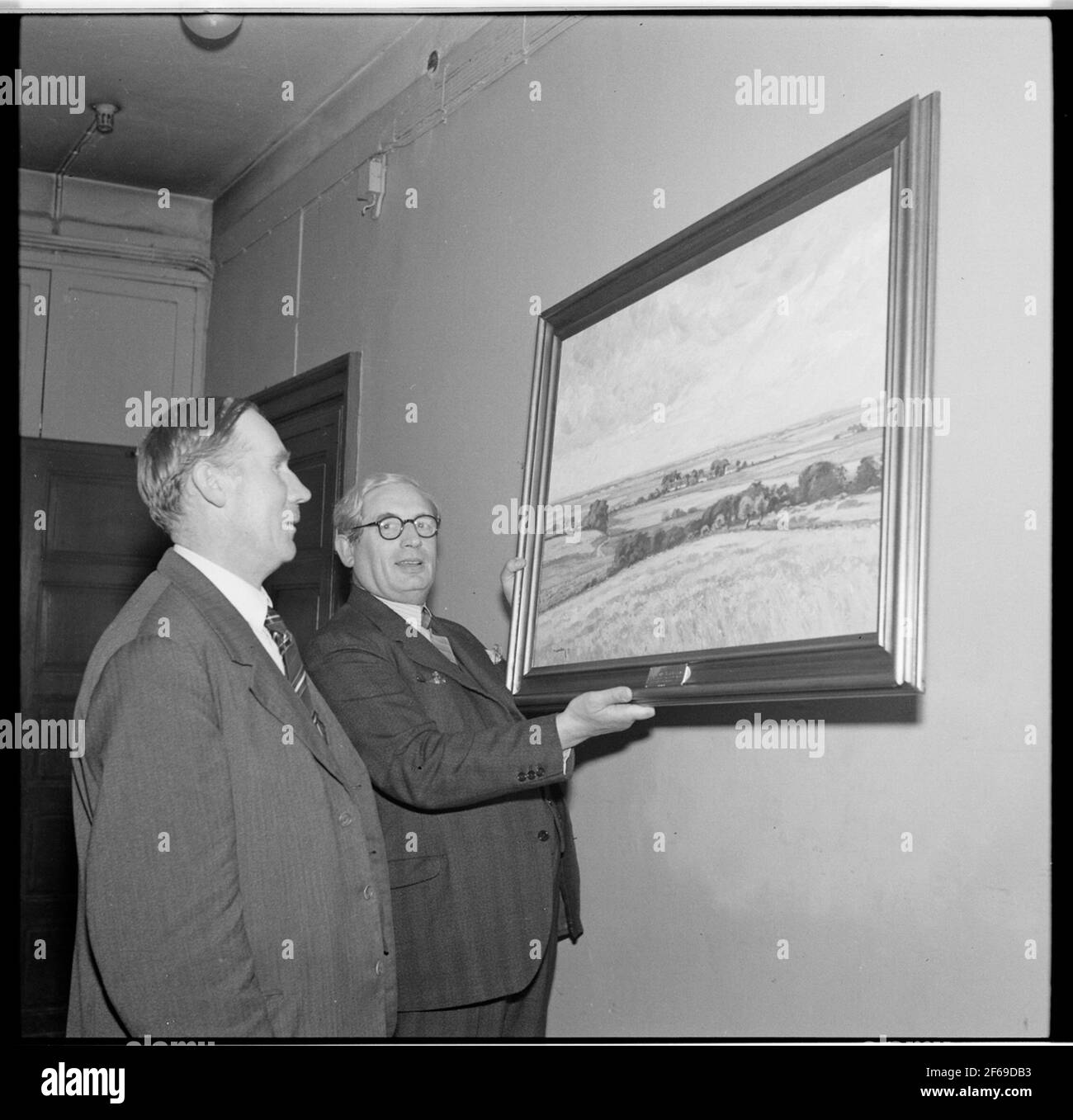 Two men admire artwork Stock Photo - Alamy