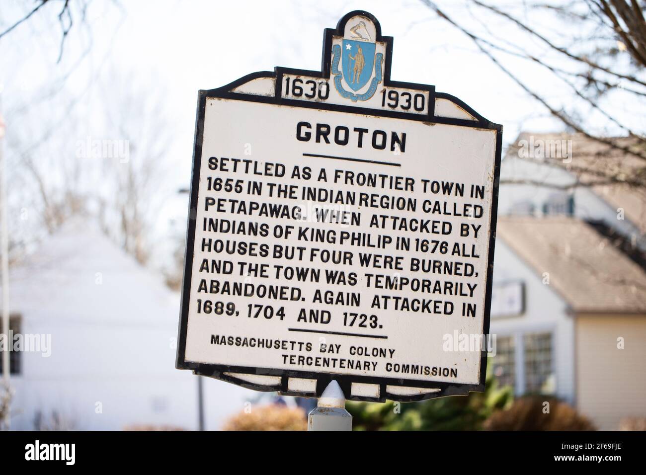A historic tercentenary sign from 1930 stands on Main Street in Groton ...