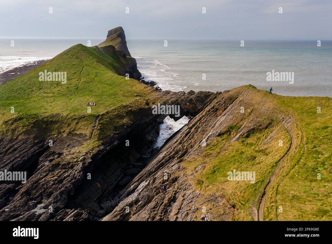 Aerial view of a natural rock arch on a spectacular coastline (Worms ...