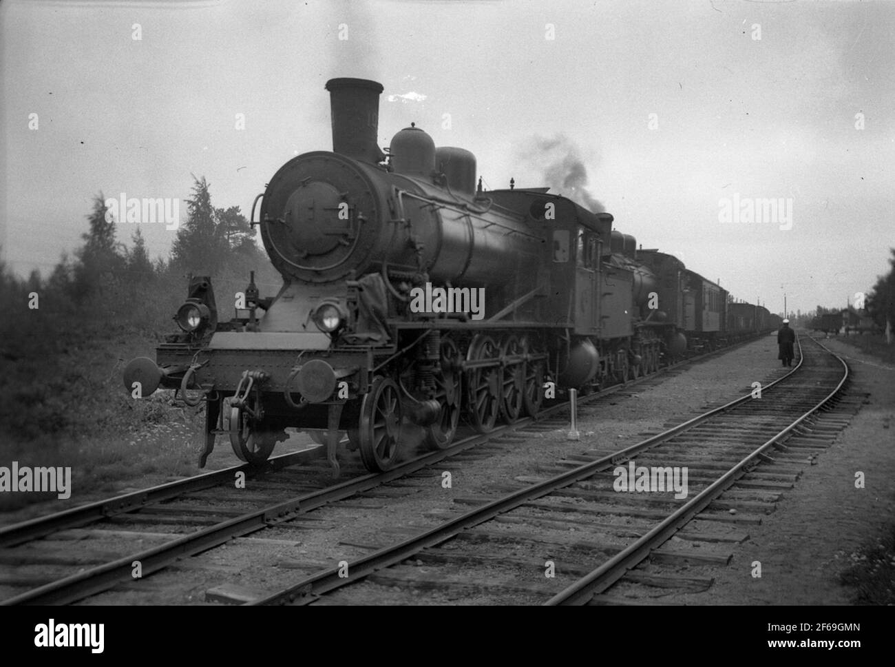 State Railways, SJ E2 1096 and SJ E2 957 with freight trains Stock ...