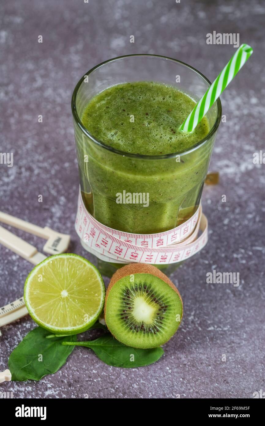 Fresh smoothie drink in a tall glass glass with a centimeter and a ...