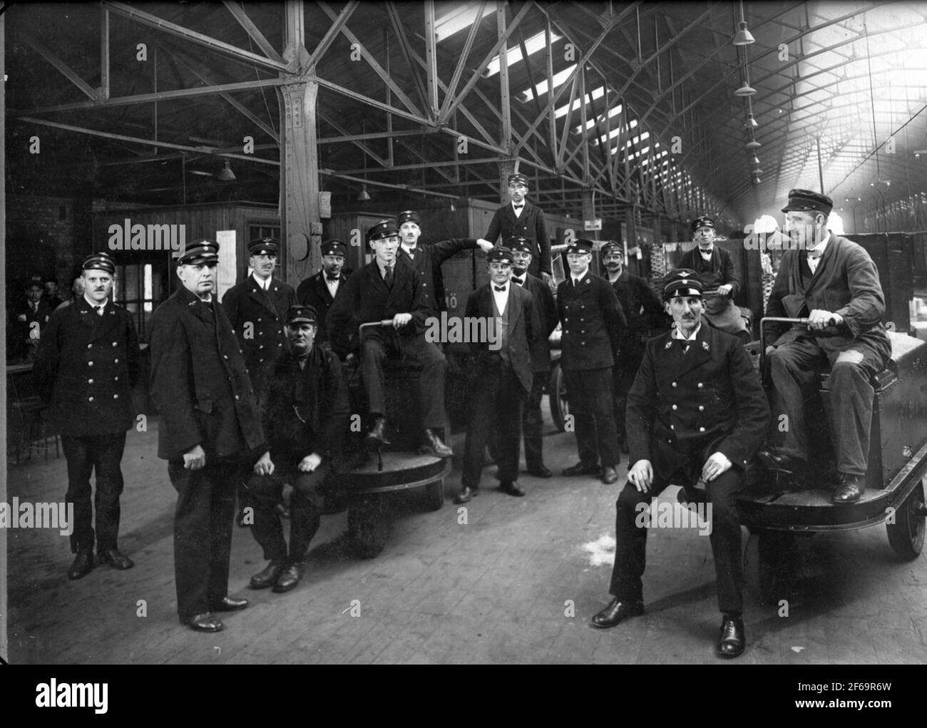 Station staff with trucks Stock Photo - Alamy