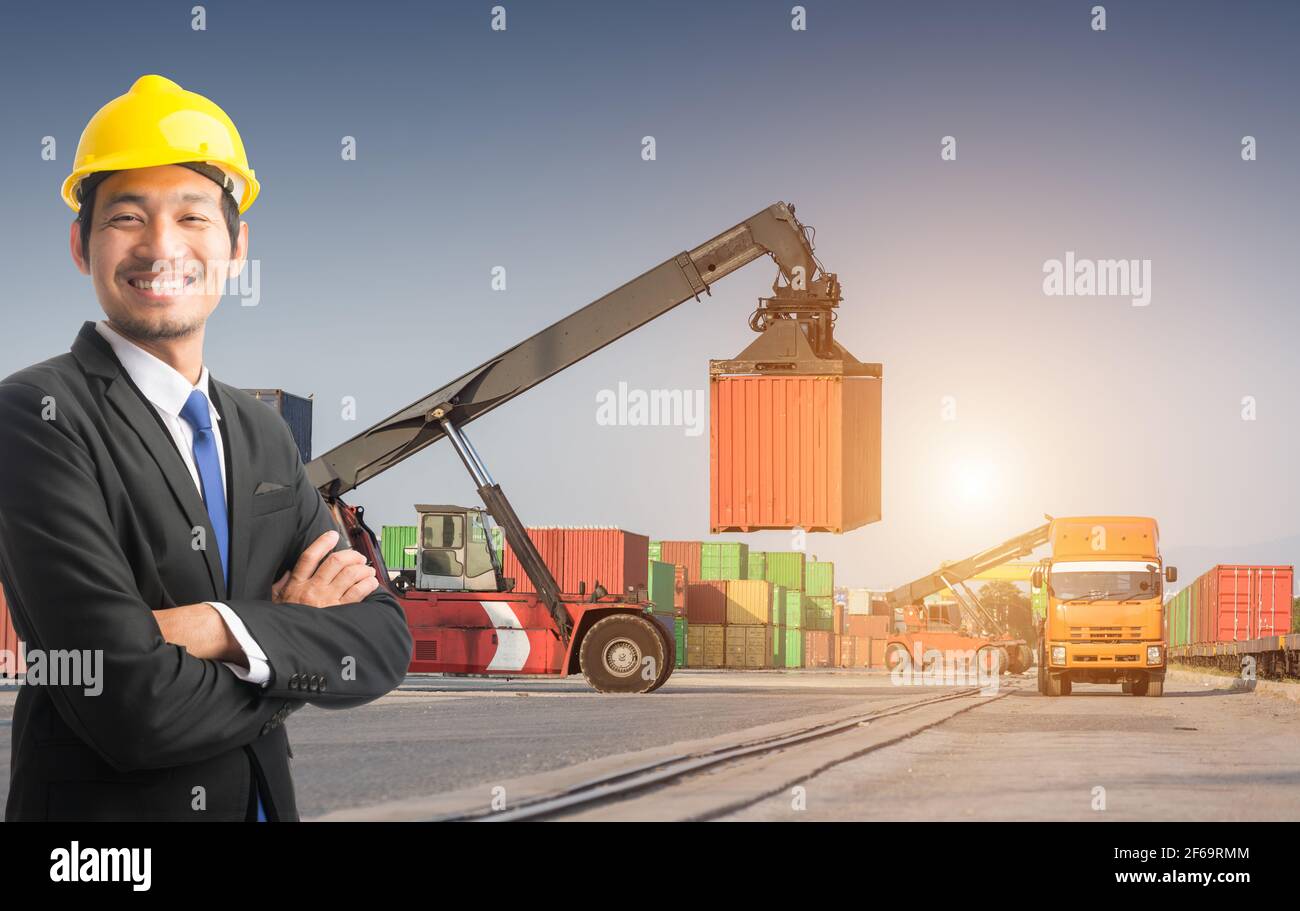 Businessman stand on front forklift loading Containers box to Logistic ...