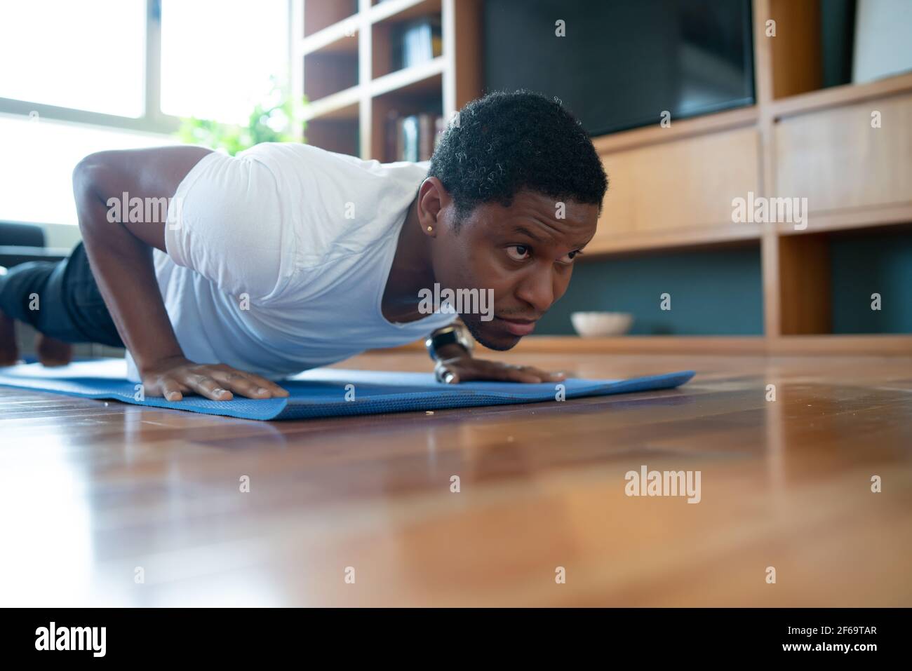 Man doing exercise at home Stock Photo - Alamy