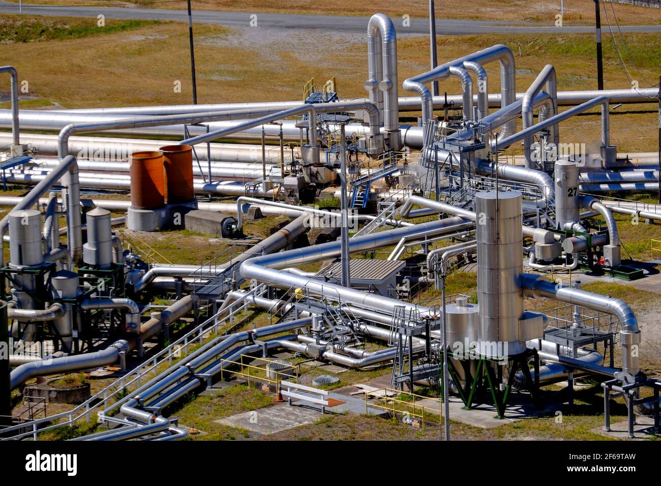 An intricate web of pipework on a volcanic geothermal energy field ...