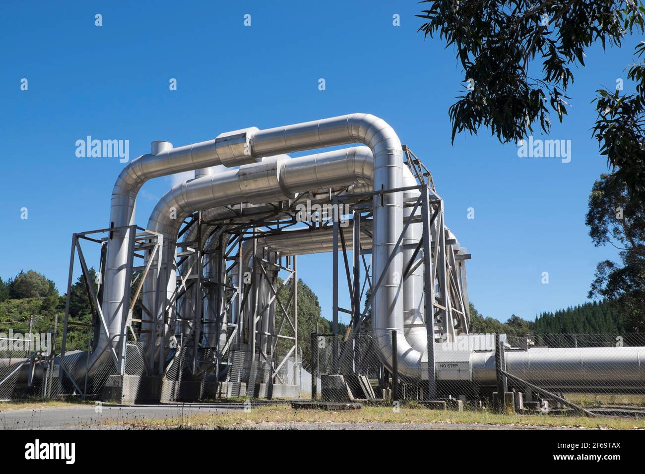 A geothermal pipeline raised over a roadway, it provides renewable ...