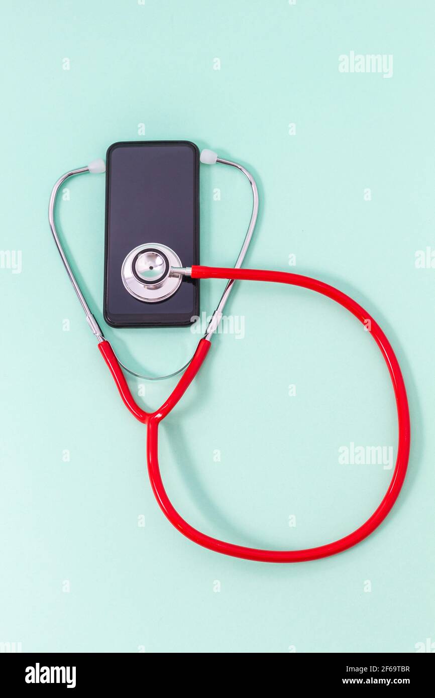 Top view of red stethoscope with red stethoscope headset listening to ...