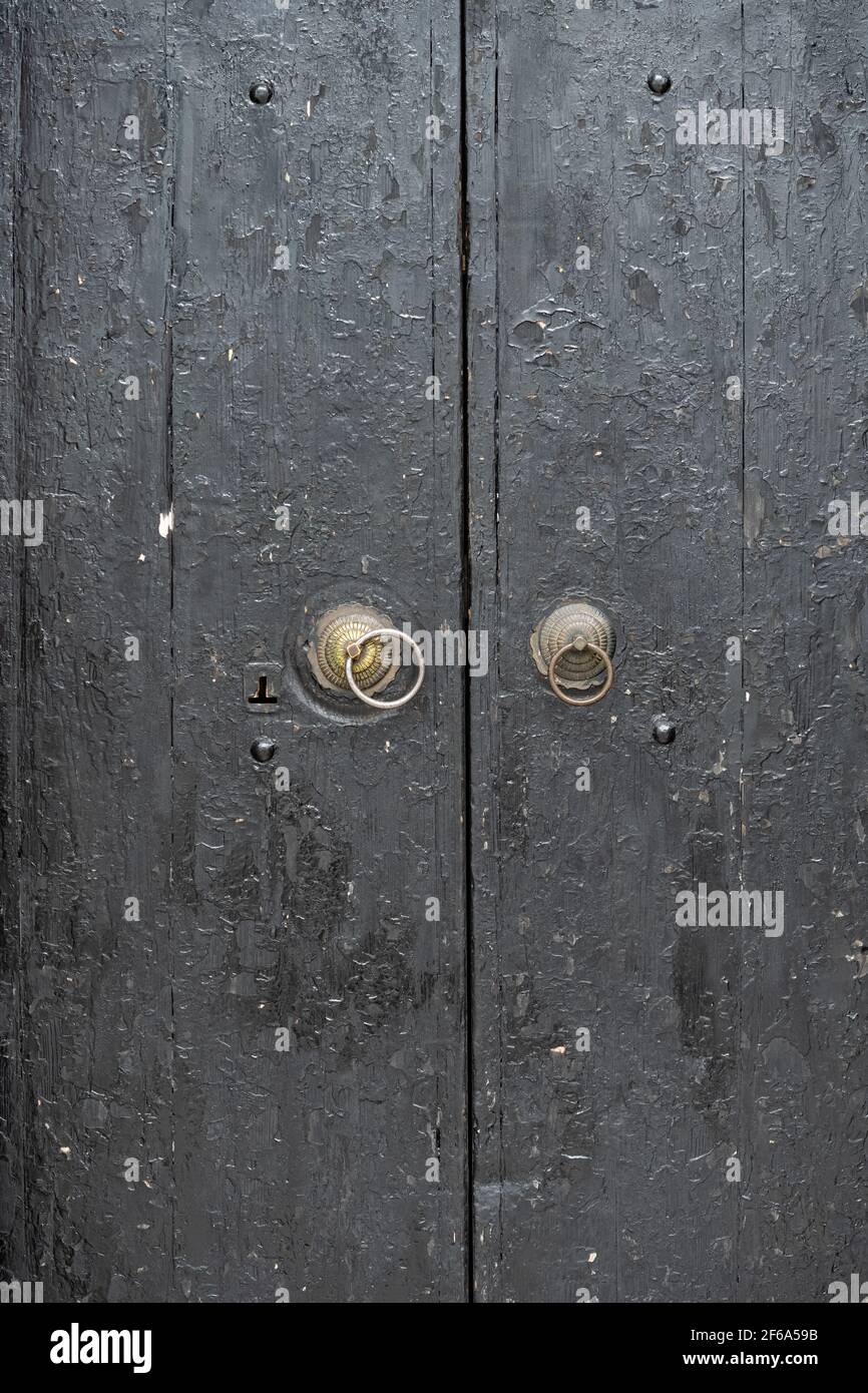 ancient black wooden gate at vertical composition Stock Photo - Alamy