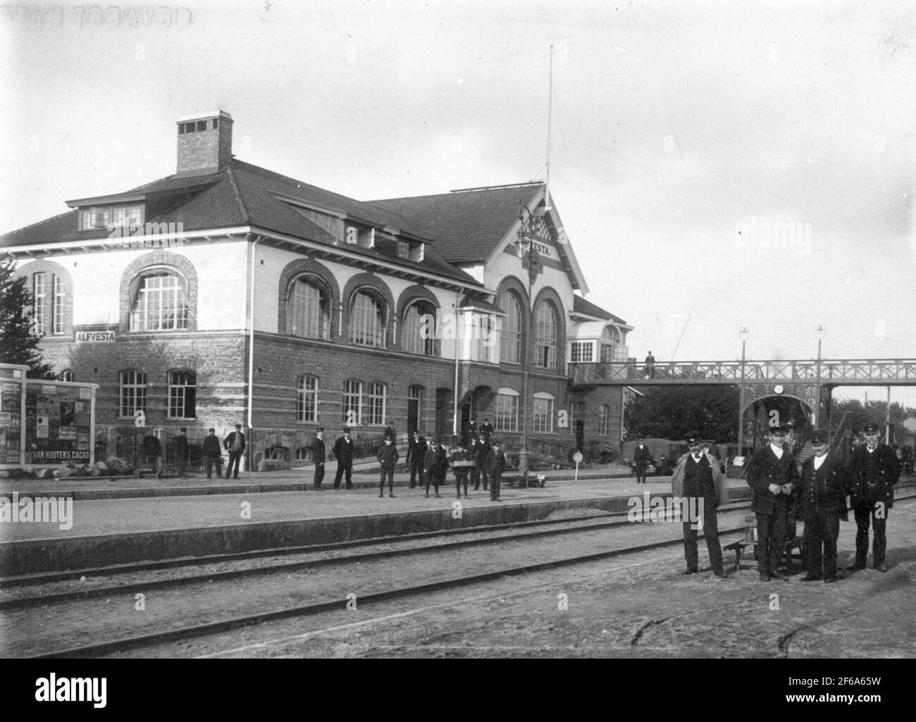 New station house in brick and iron bridge over the tracks Stock Photo ...