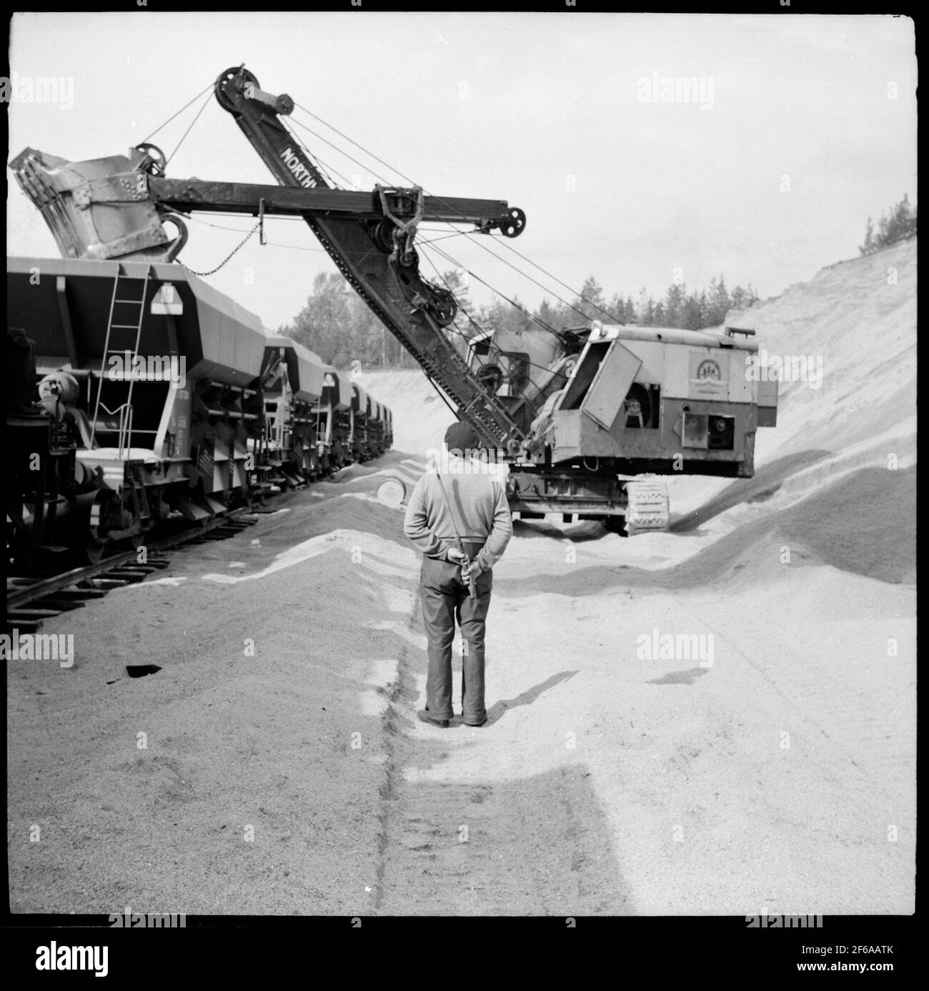 Loading gravel in the yard snow pit Stock Photo - Alamy