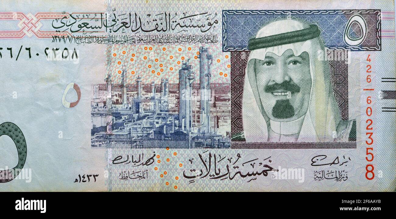 Saudi Arabia 5 riyals money background with the photo of king Abdullah ...