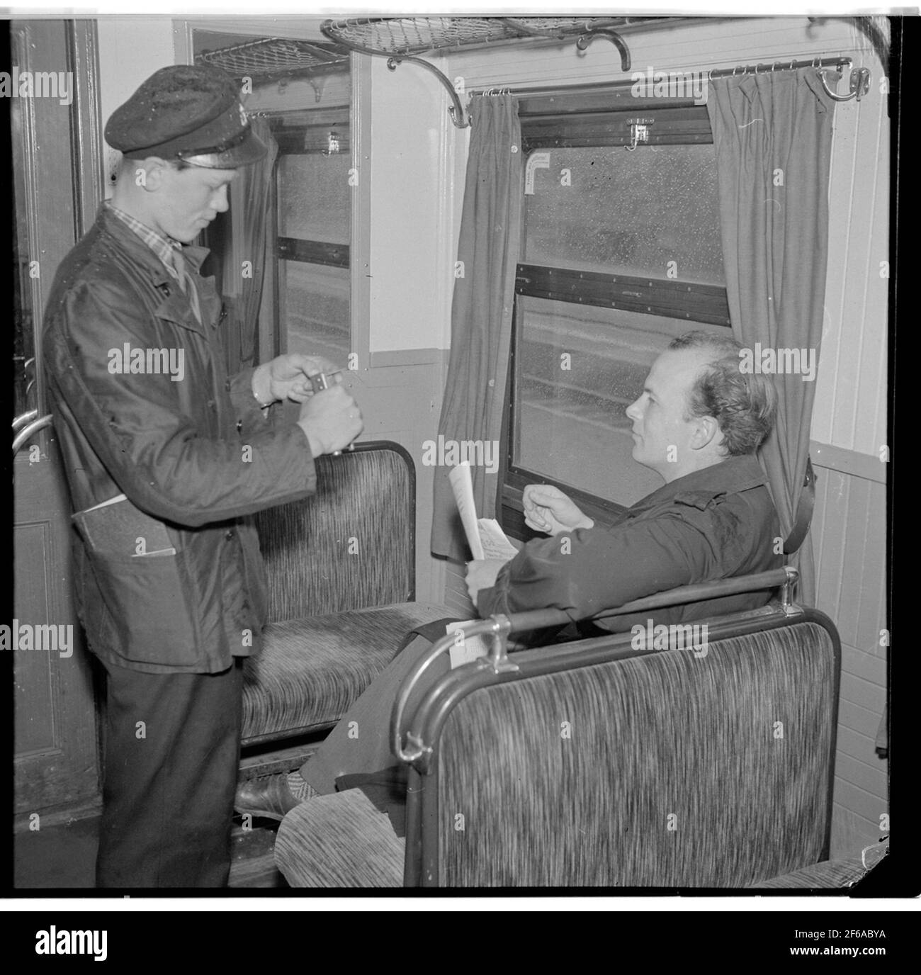 Ticket control on the passenger train Stock Photo - Alamy