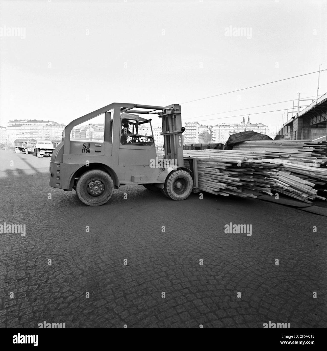 Wood and cable load with Truckliljeholmens rail yard Stock Photo - Alamy