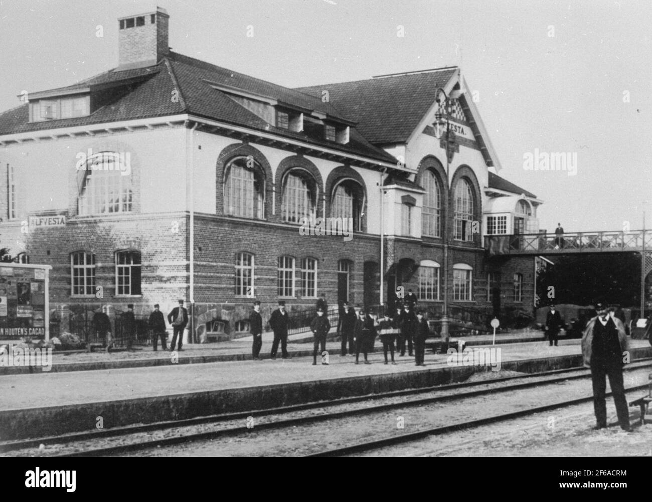 New station house in brick and iron bridge over the tracks Stock Photo ...