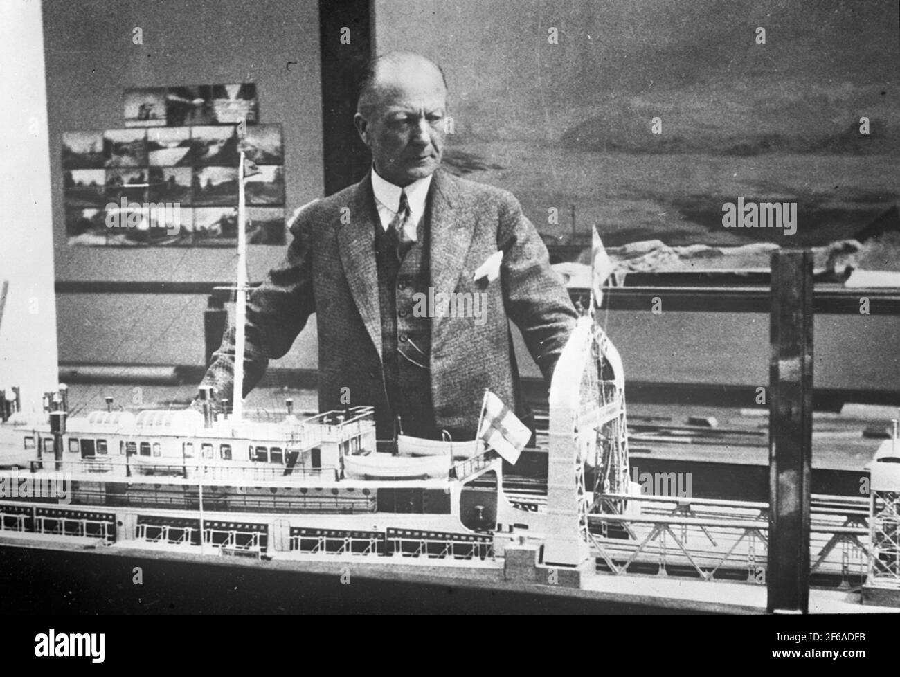 Oscar Werner in front of a model of train ferry exhibition Stock Photo ...