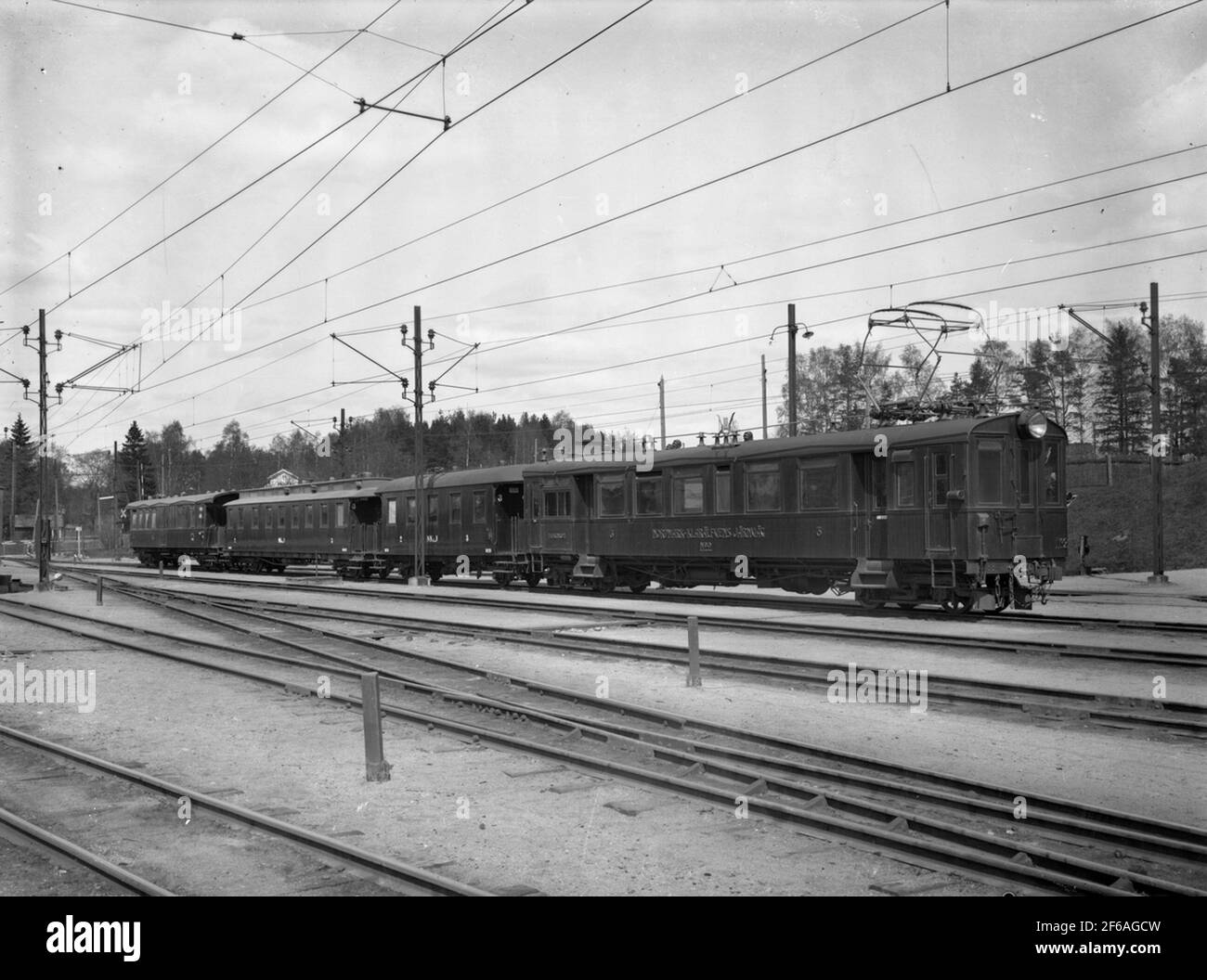 NKLJ electric motor carriage 2 with passenger train Stock Photo - Alamy