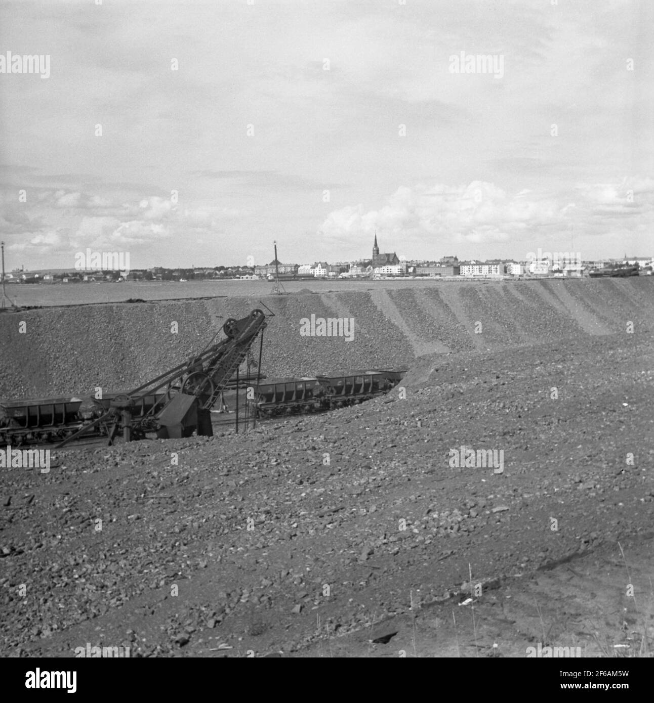 Loading ore at ore storage on black island. SJ mas Stock Photo - Alamy