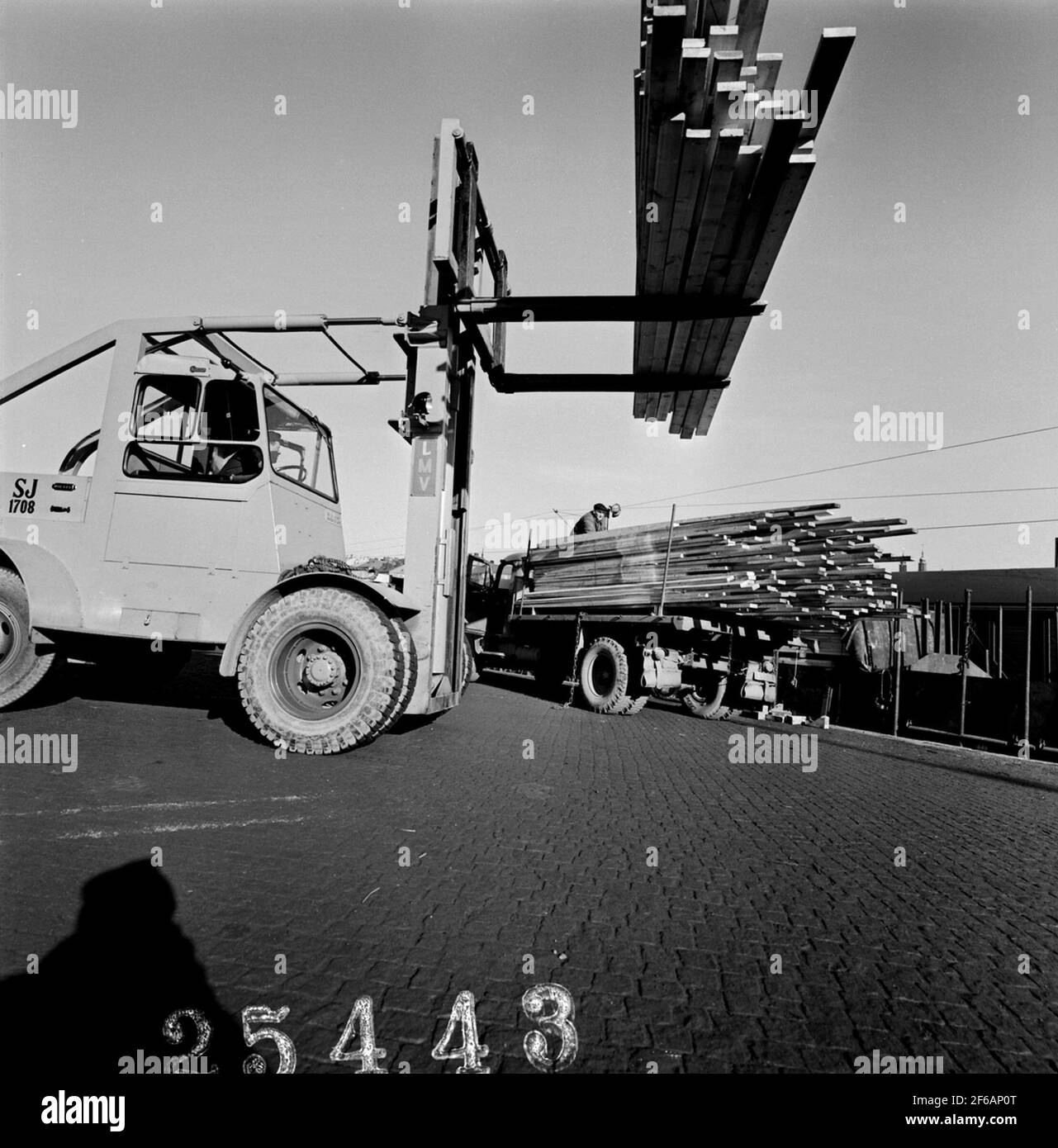 Wood and cable load with Truckliljeholmens rail yard Stock Photo - Alamy