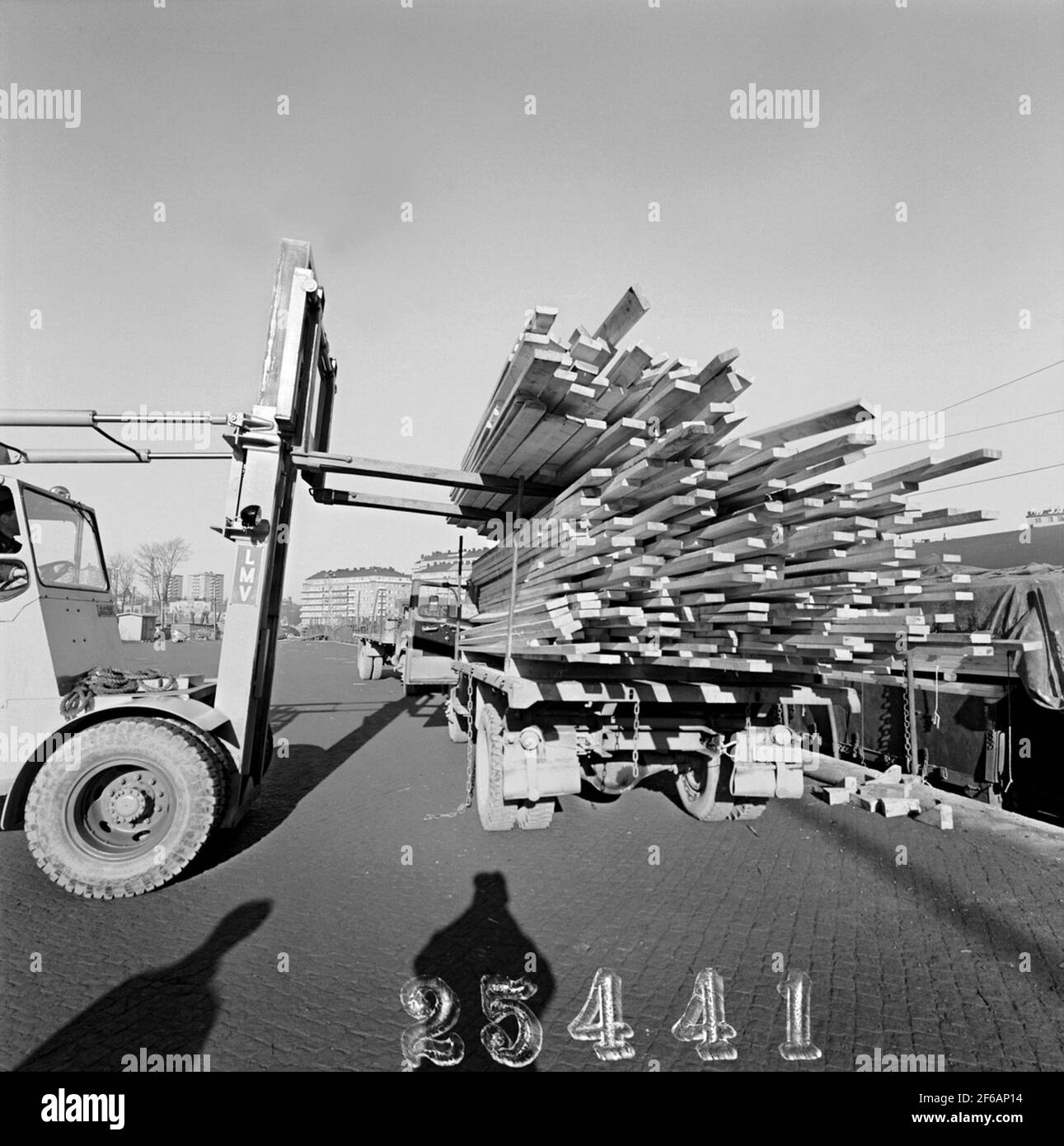 Wood and cable load with Truckliljeholmens rail yard Stock Photo - Alamy