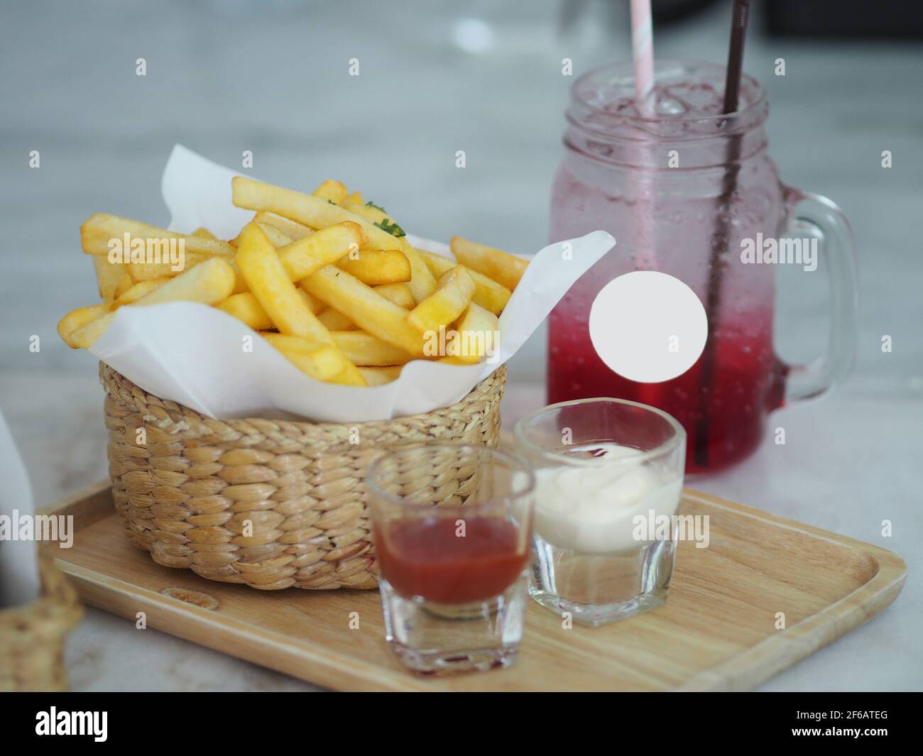 French fries potato snack golden yellow color Delicious crisp in wicker ...