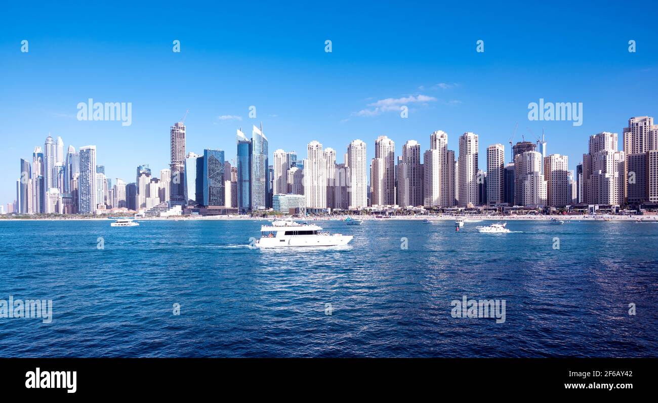 Panoramic view of the cruise ships and skyscrapers at the dubai marina ...
