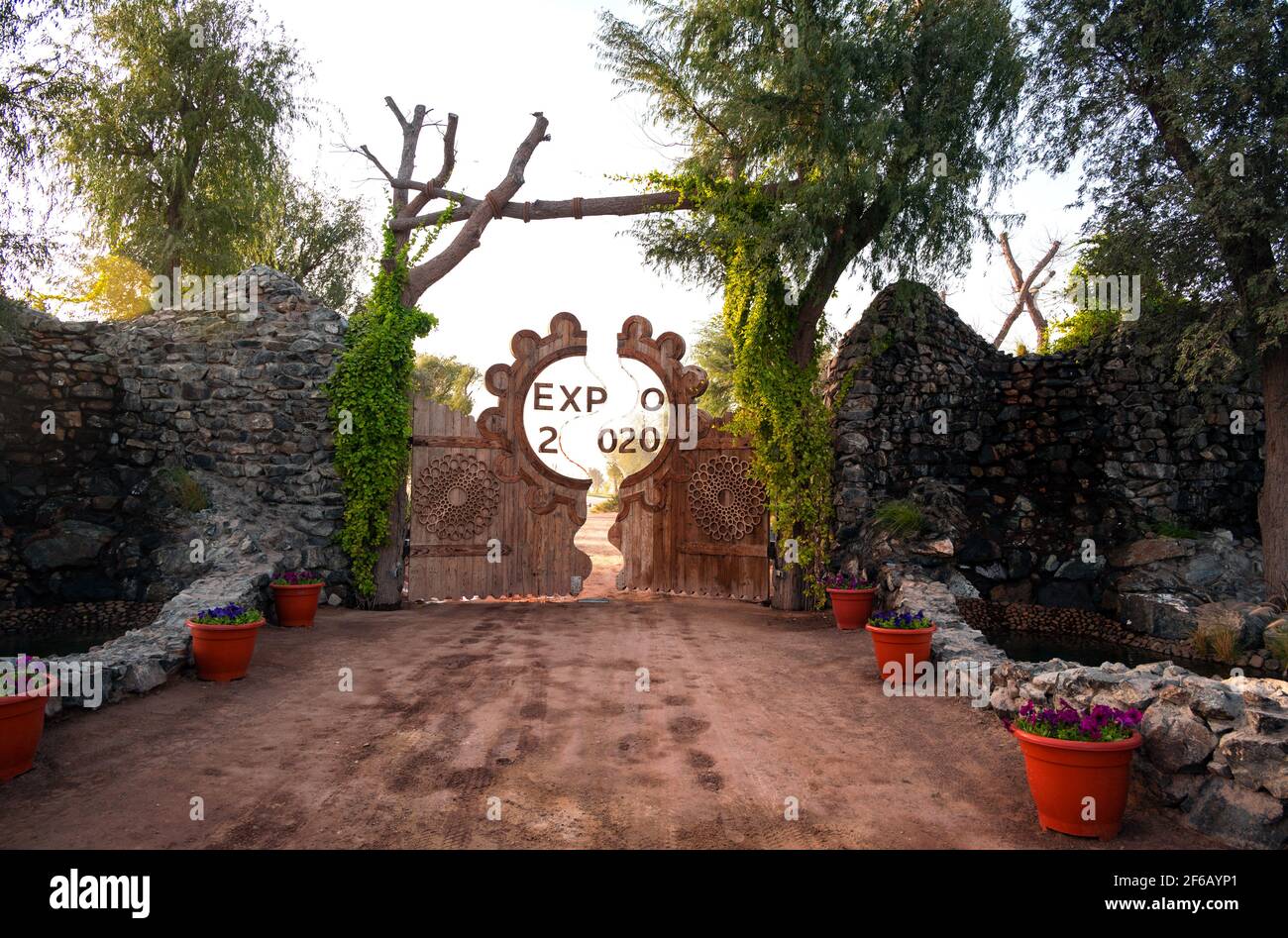 The beautiful entrance to the expo 2020 lakes with muddy desert path ...