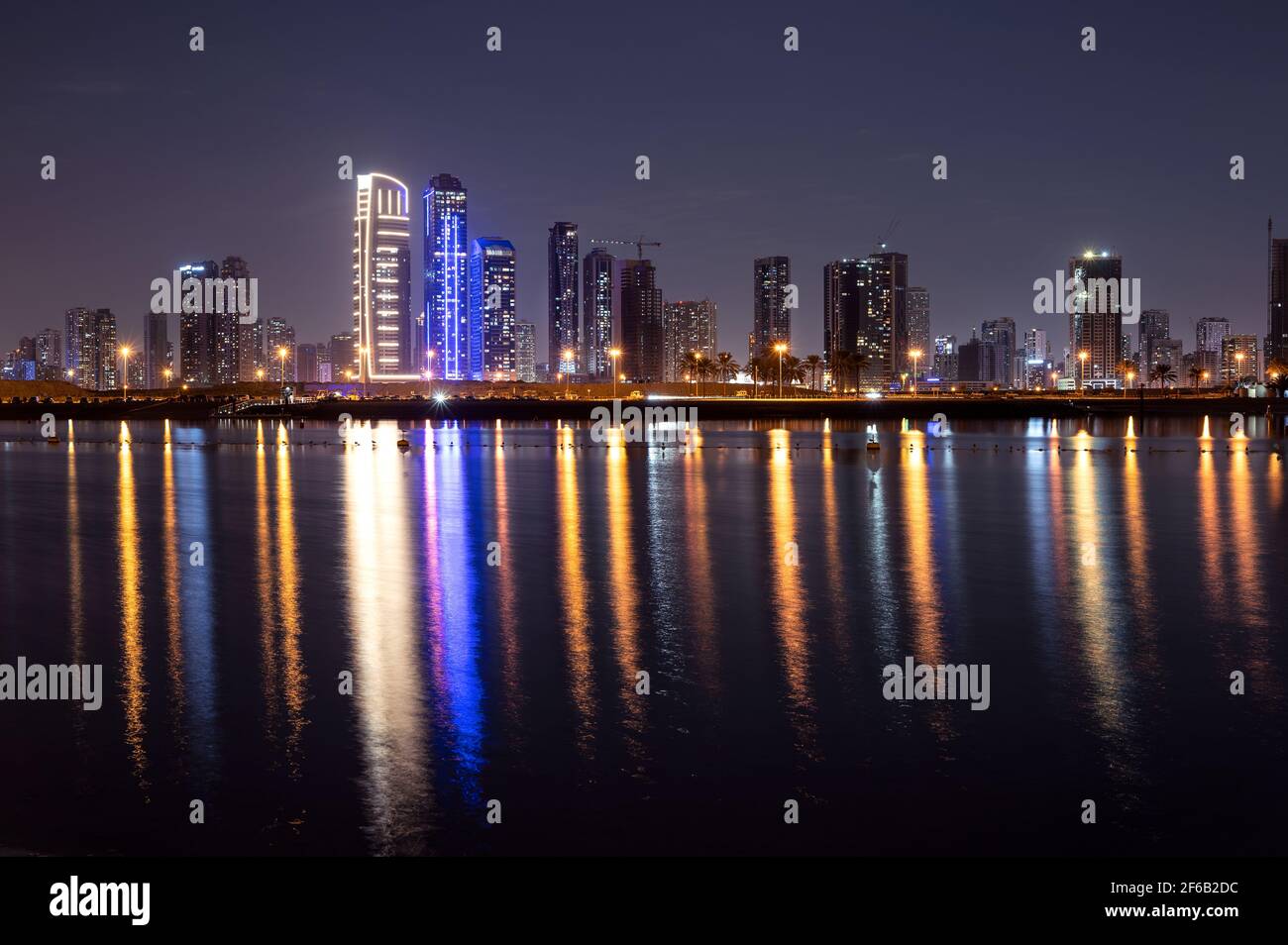 Sharjah night skyline with illuminated sky scrappers,buildings showing ...