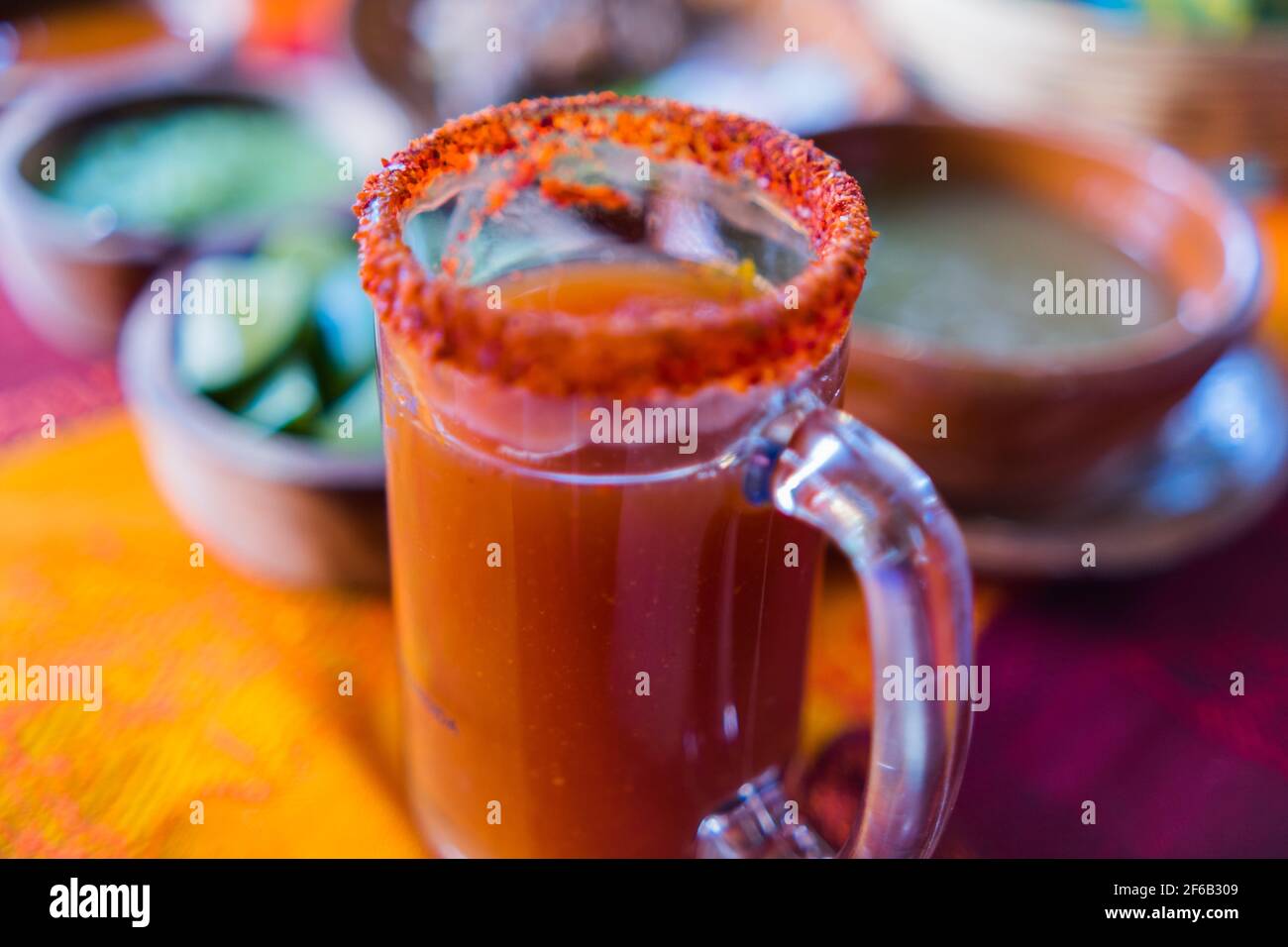 Traditional Mexican michelada in glass mug with blurry background Stock ...