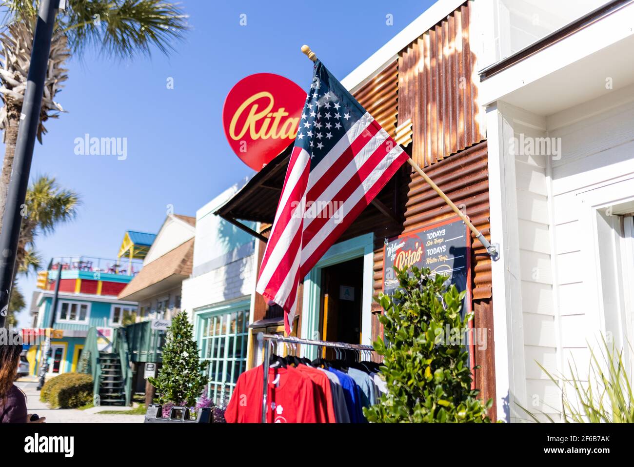 American flag hanging outside a restaurant with corrugated metal walls ...