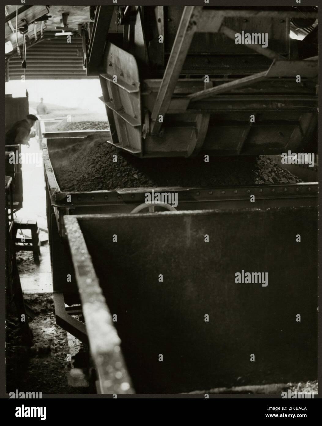Semi-automatic loading of ore in ore cars at Grängesberg's ore Stock ...