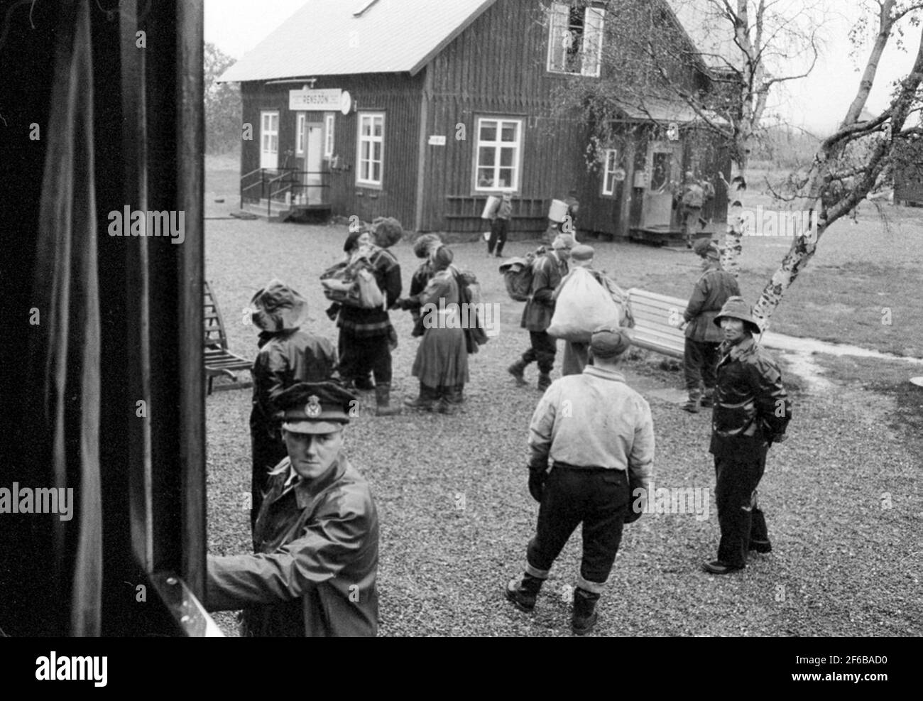 Sami in traditional dress at Rensjön station. To the left train ...