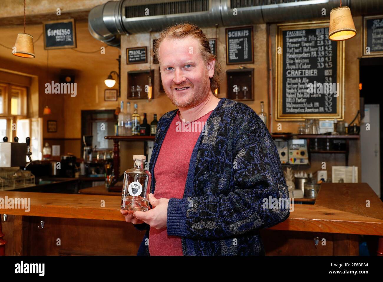 Berlin, Germany. 30th Mar, 2021. Bar owner and inventor of "Rotbier Bierbrand" Simon Frohberger ...