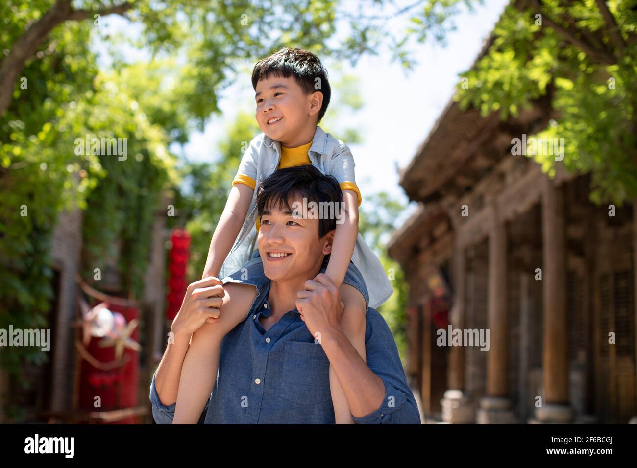 Happy Chinese father and son enjoying vacation Stock Photo - Alamy